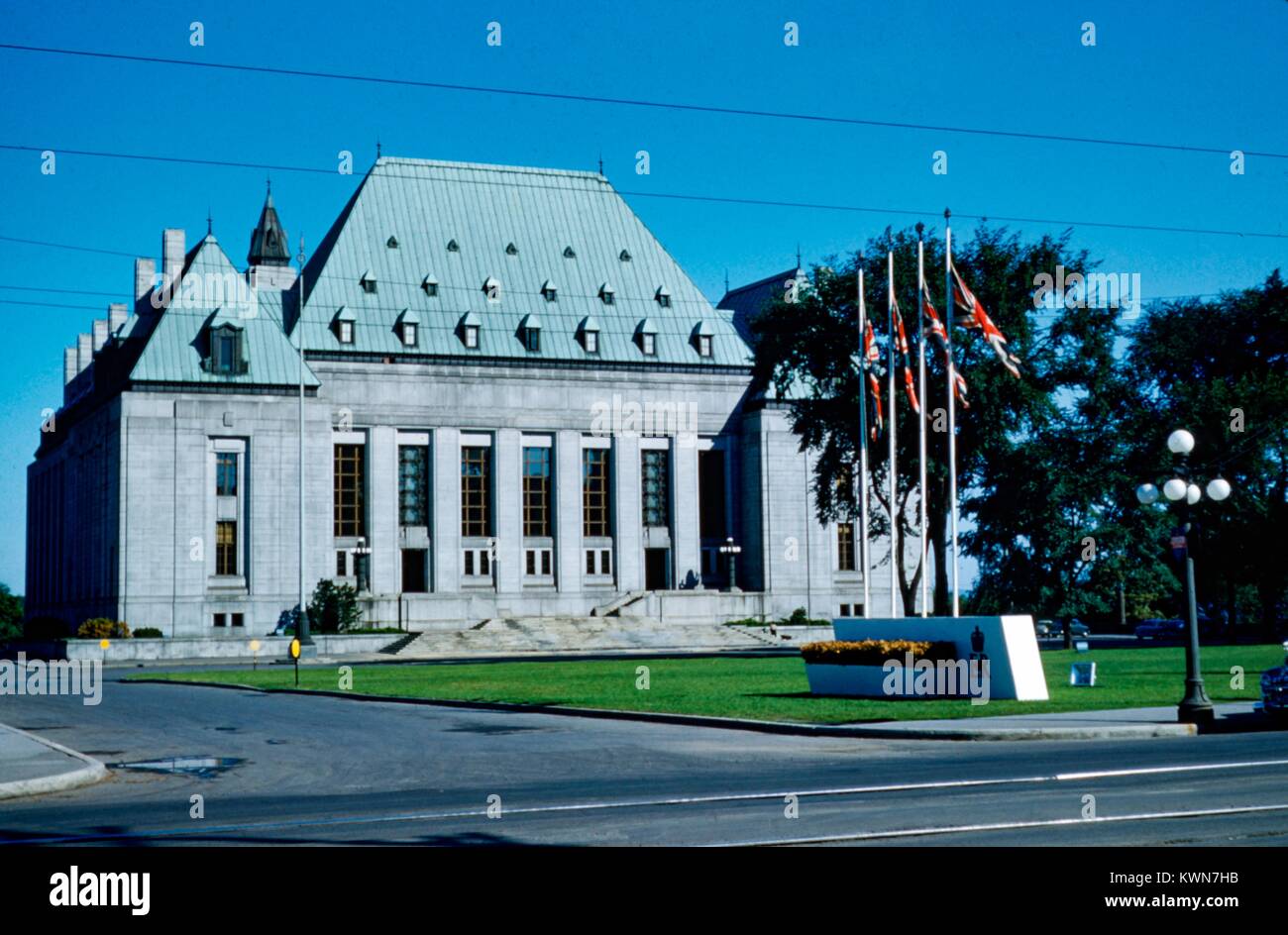 Facade of the Supreme Court of Canada with Canadian flags flying ...