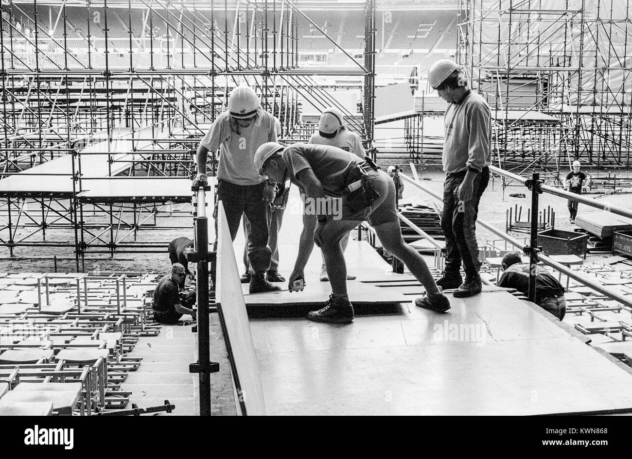 Edwin Shirley Staging crew building a stage in Wembley Stadium for the ...