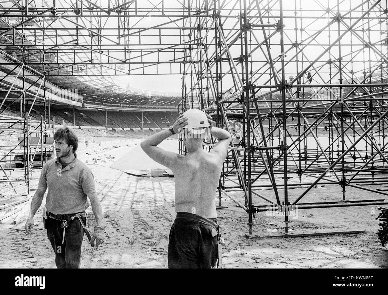 Edwin Shirley Staging crew building a stage in Wembley Stadium for the ...