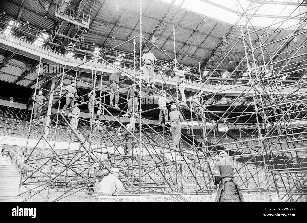 Edwin Shirley Staging crew building a stage in Wembley Stadium for the ...
