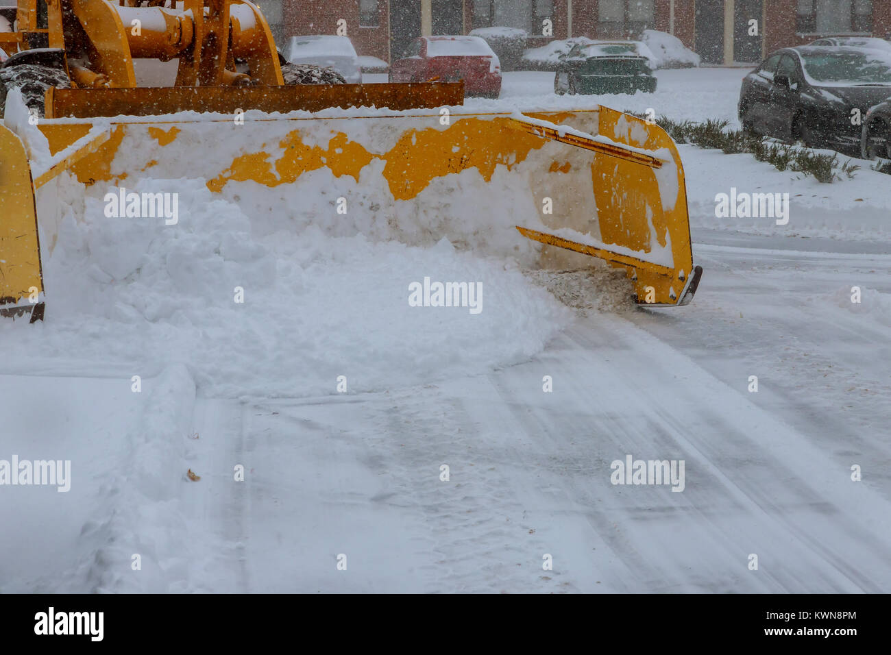 Winter storm snow cleaning machine . Tractor clears the way after heavy ...