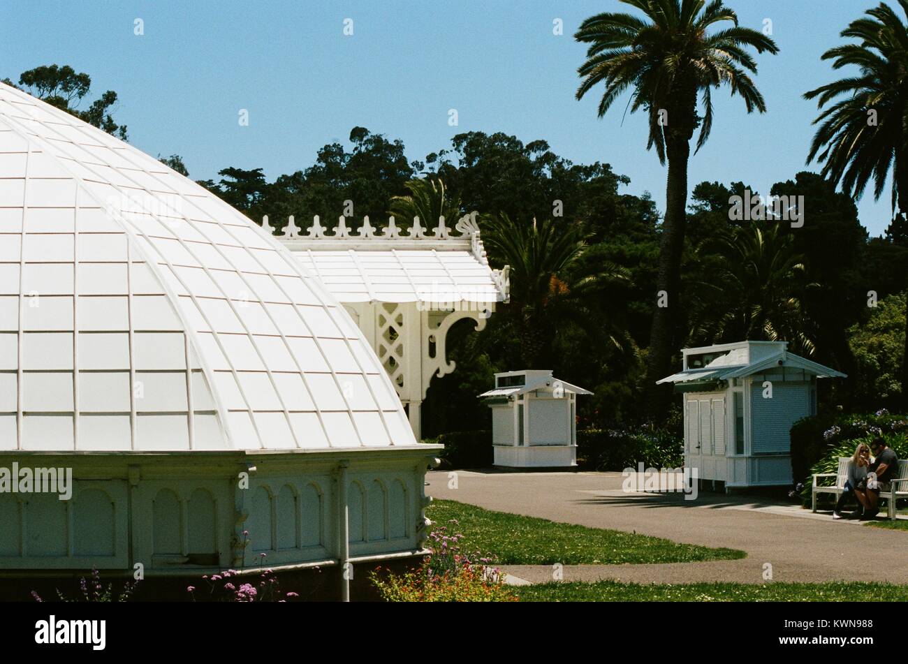 Side view, with palm trees and visitors on a bench visible, at the ...