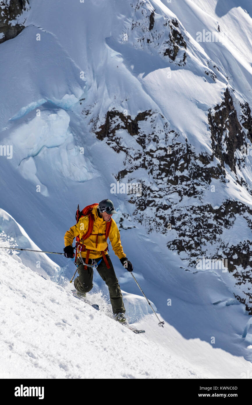 Alpine telemark ski mountaineer skiing downhill in Antarctica; Nansen ...