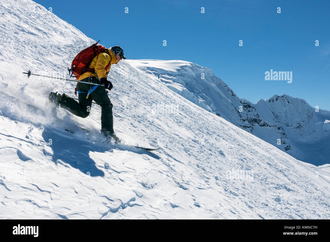 Alpine telemark ski mountaineer skiing downhill in Antarctica; Nansen ...
