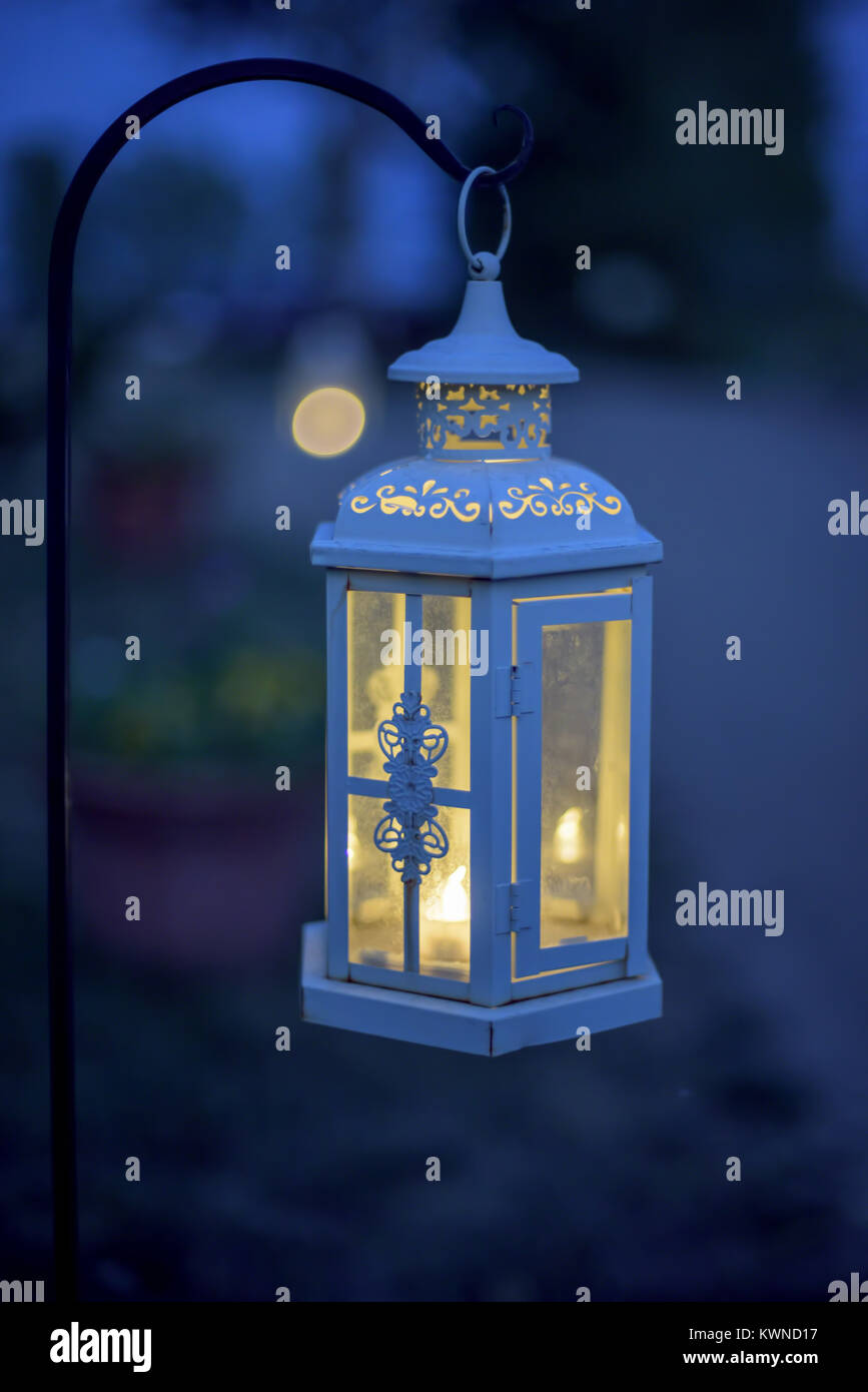 glowing lantern on hook along path in the dark Stock Photo - Alamy
