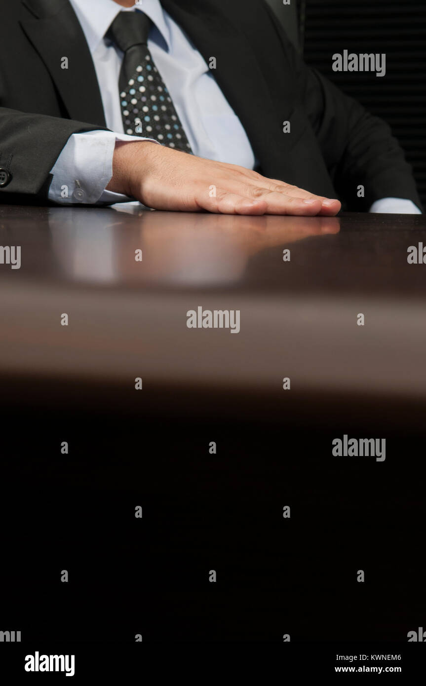 Close up of a businessman's hand on the desk Stock Photo - Alamy