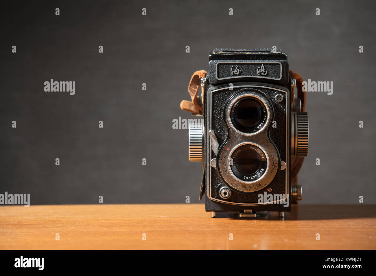 A Seagull 4 TLR Twin Lens Reflex Camera with brown strap on a table ...