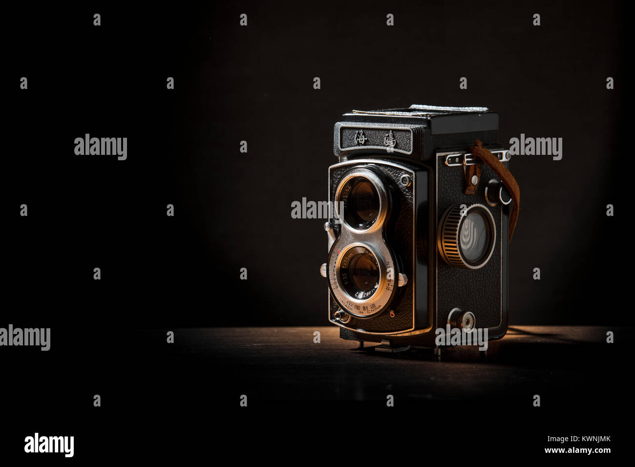 A Seagull 4 TLR Twin Lens Reflex Camera with brown strap on a table ...