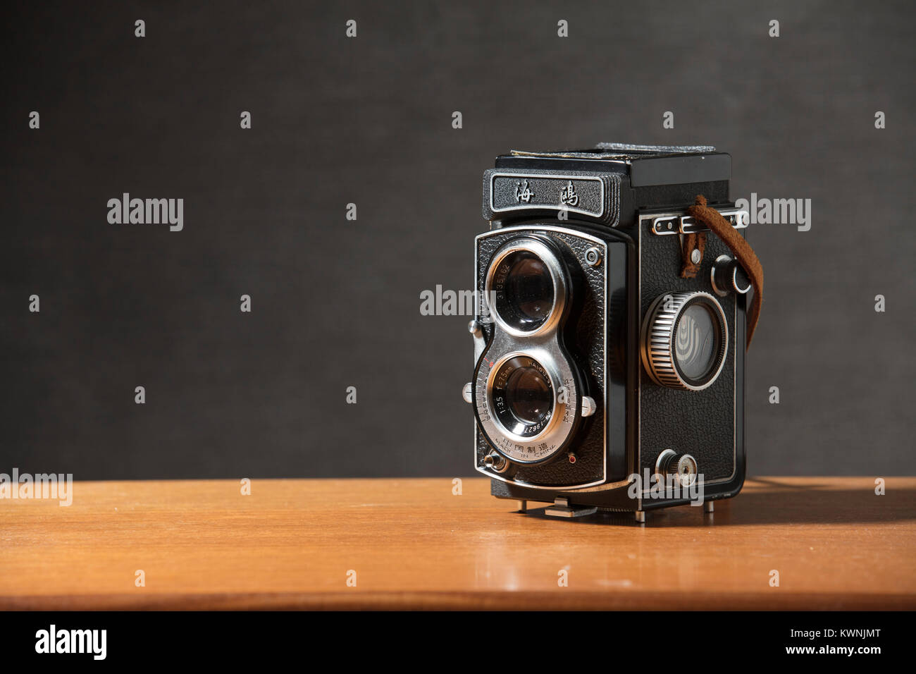 A Seagull 4 TLR Twin Lens Reflex Camera with brown strap on a table ...