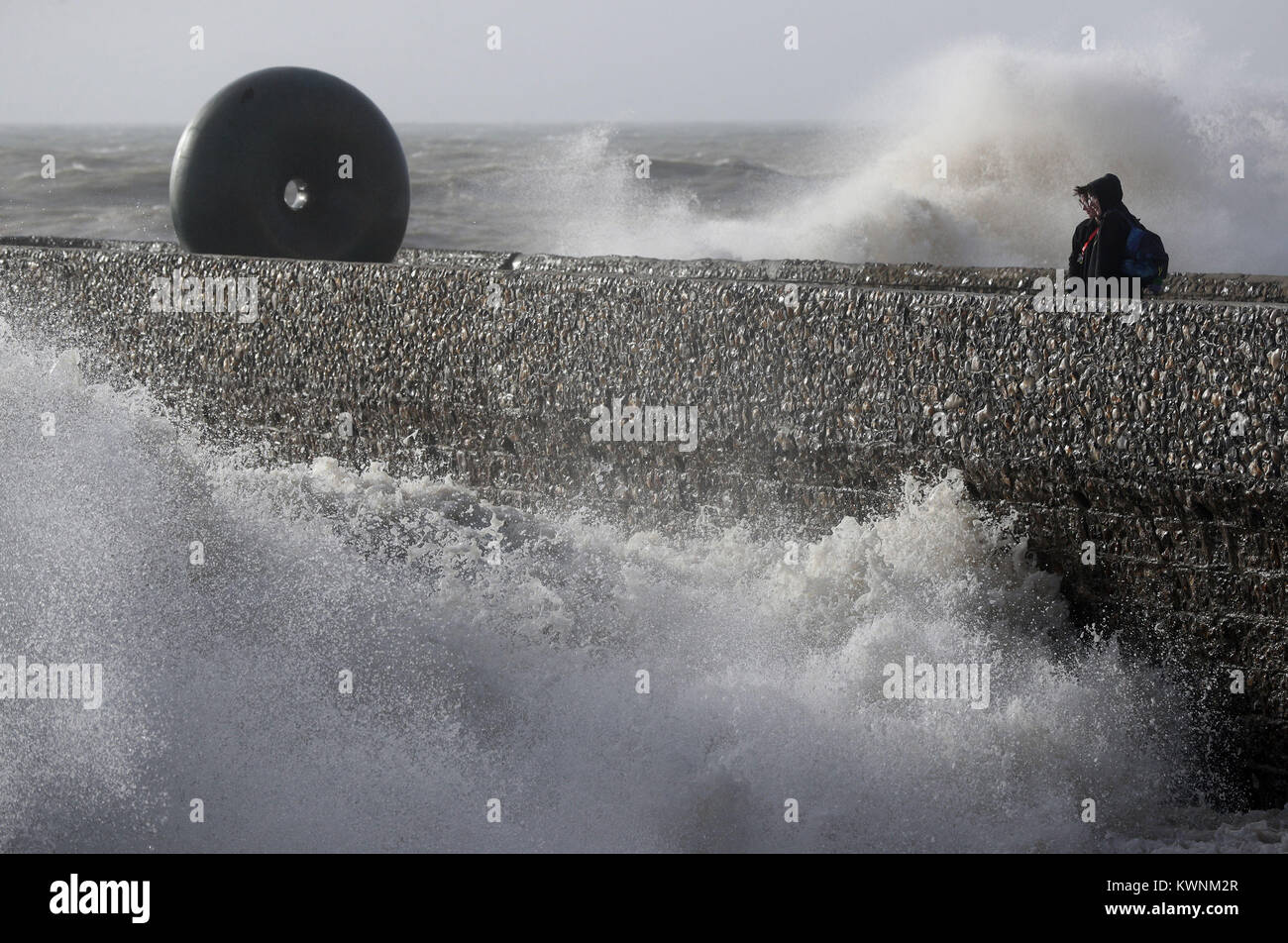 A couple stand near the 'Afloat' sculpture by East Sussex sculptor ...