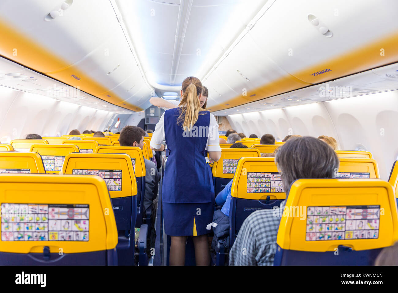 Stewardess serving passangers on Ryanair airplane flight on 14th of ...
