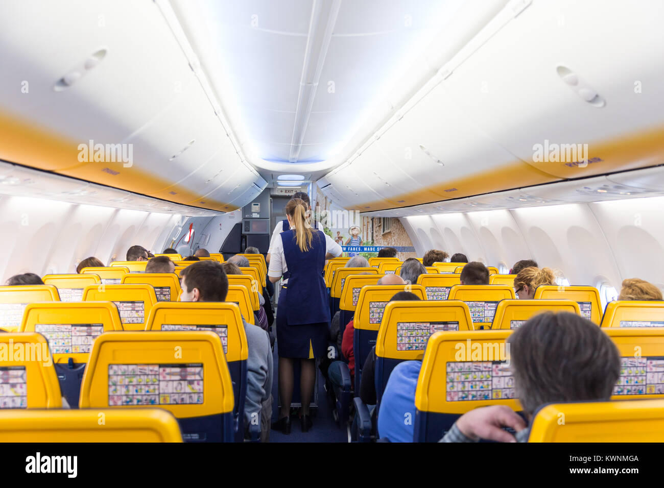 Stewardess serving passangers on Ryanair airplane flight on 14th of ...