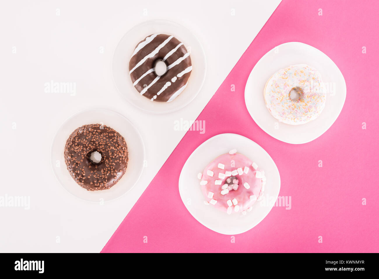 top view of various tasty doughnuts on plates Stock Photo - Alamy