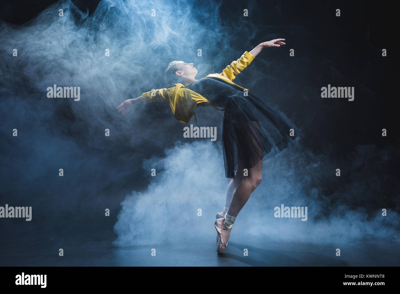 Girl dancing in smoke Stock Photo - Alamy
