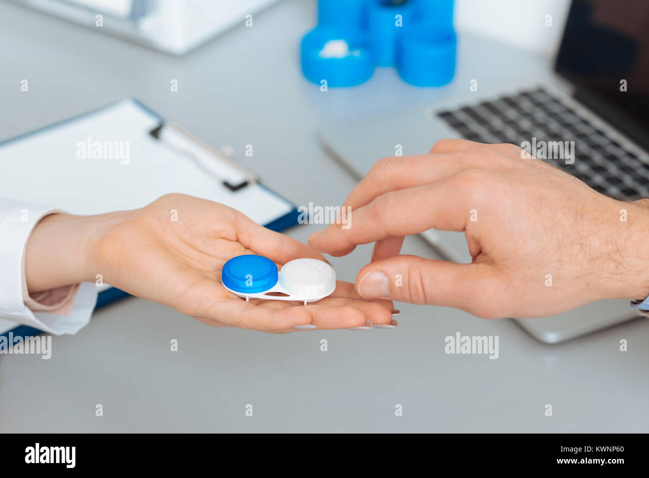 cropped shot of doctor give contact lens to patient Stock Photo - Alamy