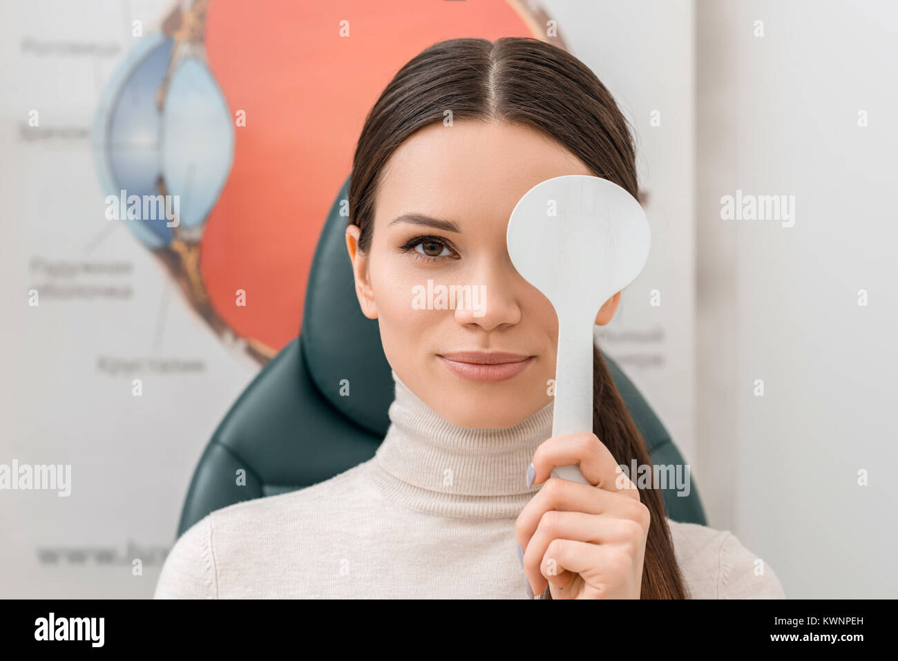 obscured view of young female patient getting eye test in clinic Stock ...
