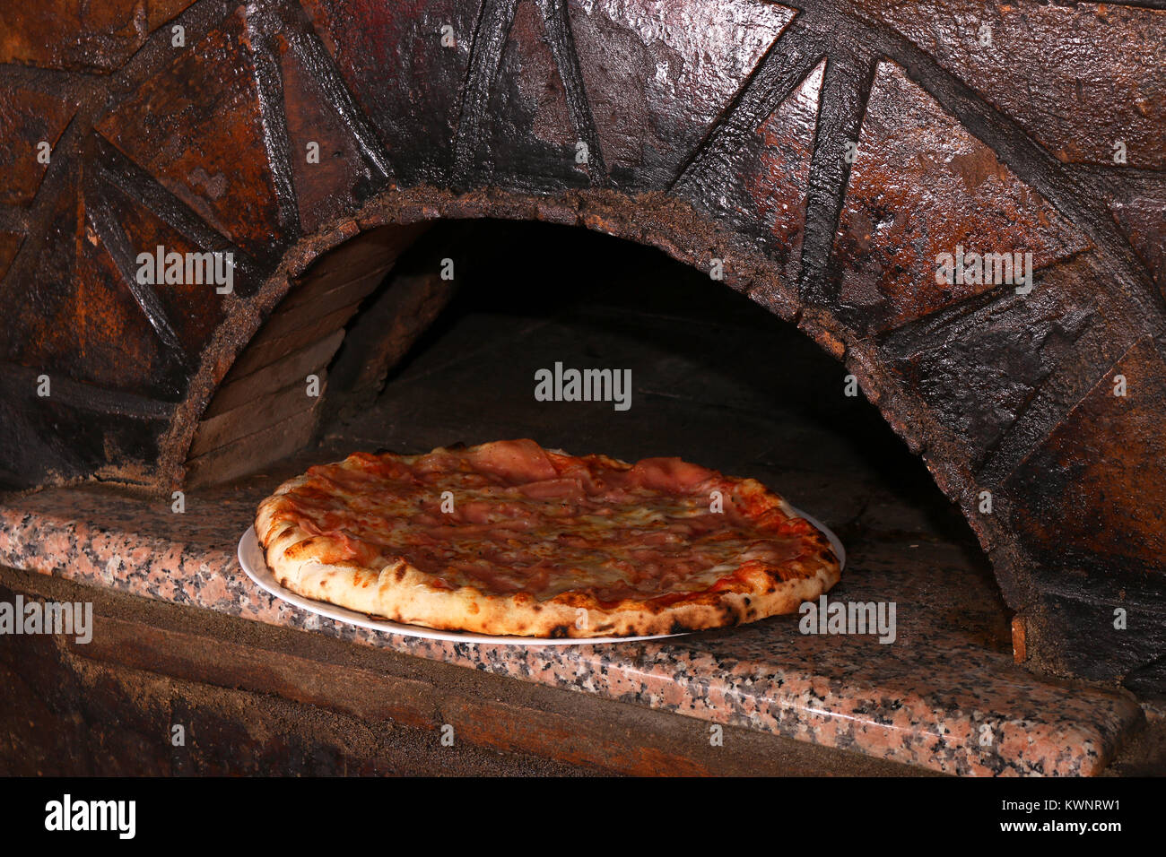 tasteful pizza and brick oven pizzeria Stock Photo - Alamy