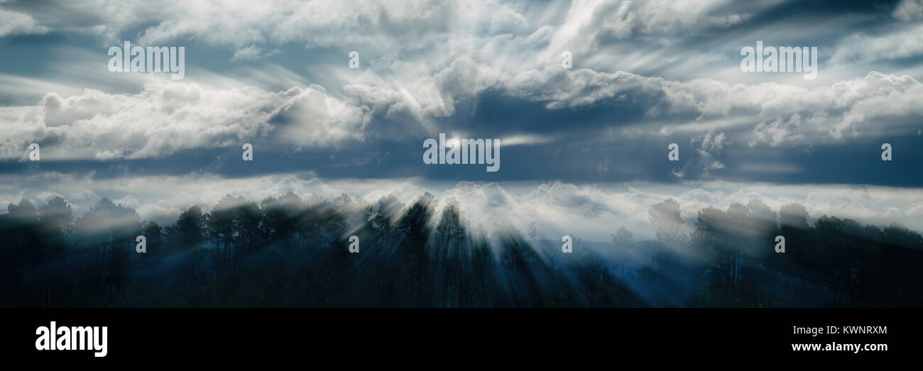 A panorama of the sun rising over the clouds Stock Photo - Alamy