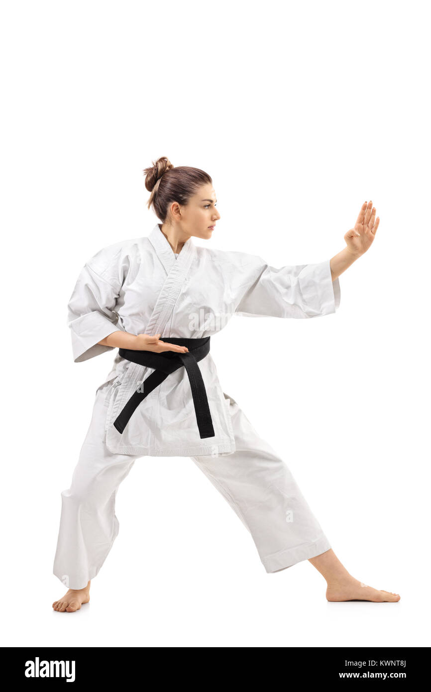 Full length profile shot of a karate girl doing a kata isolated on ...