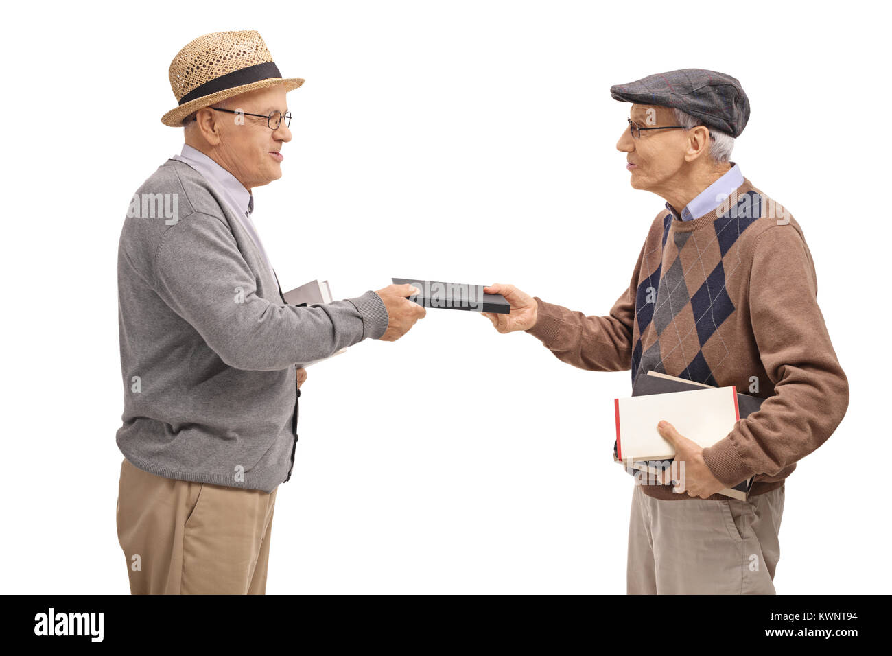 Seniors exchanging books isolated on white background Stock Photo - Alamy