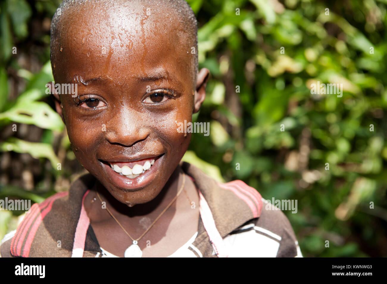 Rwandan child having a wash. Rwanda Stock Photo - Alamy