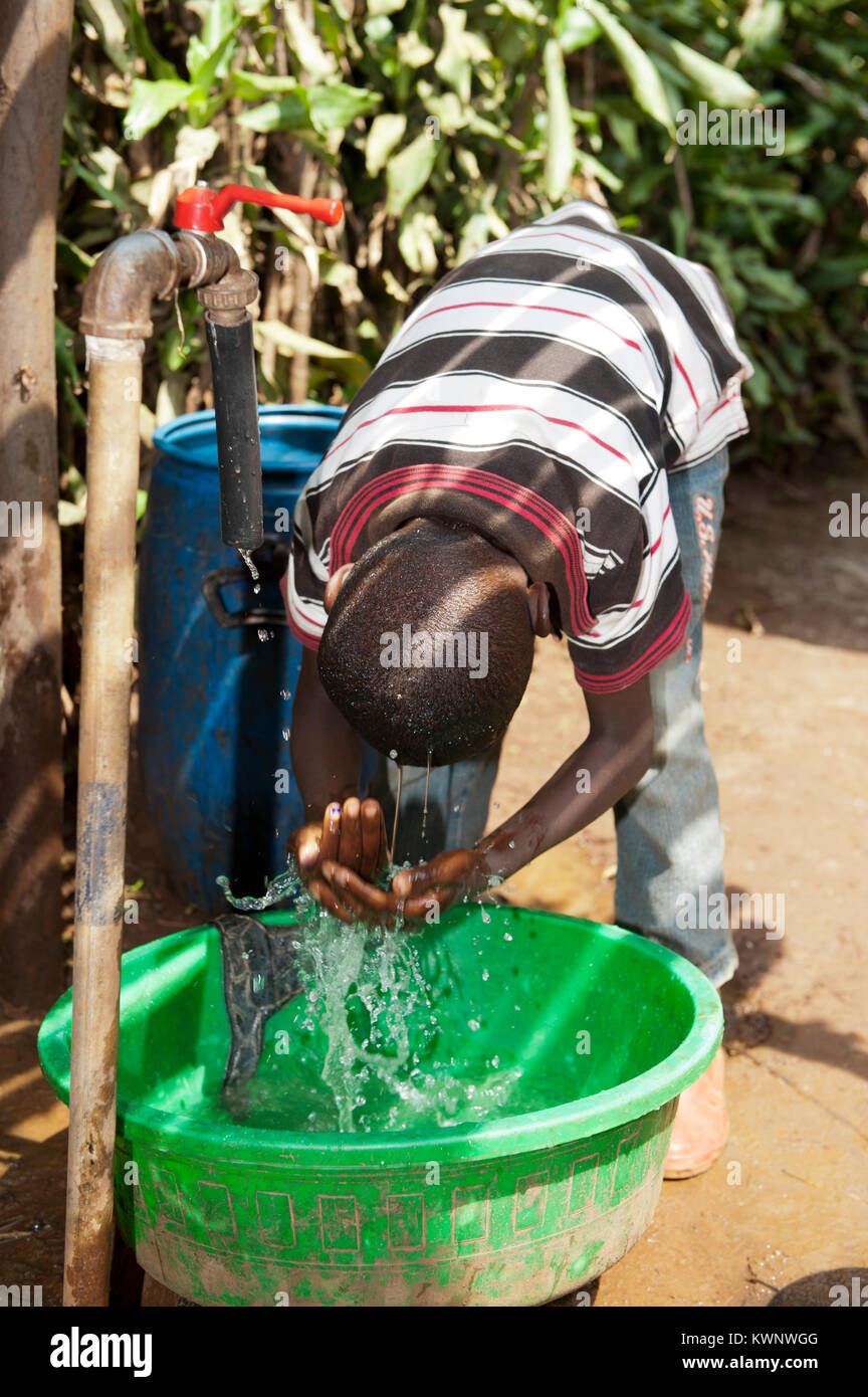 Rwandan child having a wash. Rwanda Stock Photo - Alamy