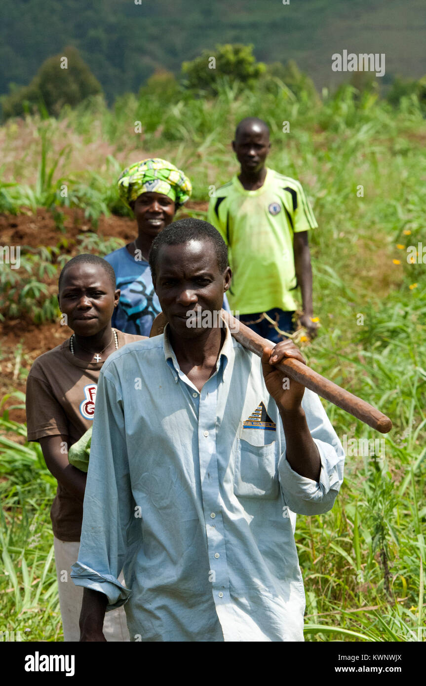 Rwandan family coming home out of the fields after a days work. Rwanda ...