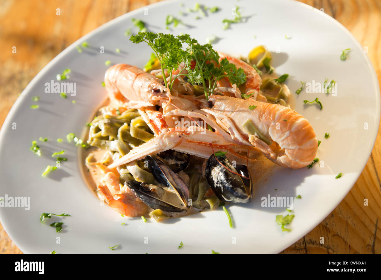 Shrimps and mussels with green pasta, restaurant Croatia Stock Photo ...