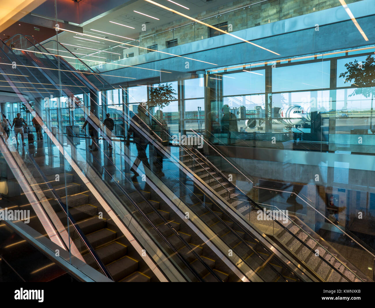 Abstract interior view of escalators & commercial jet at Ministro ...