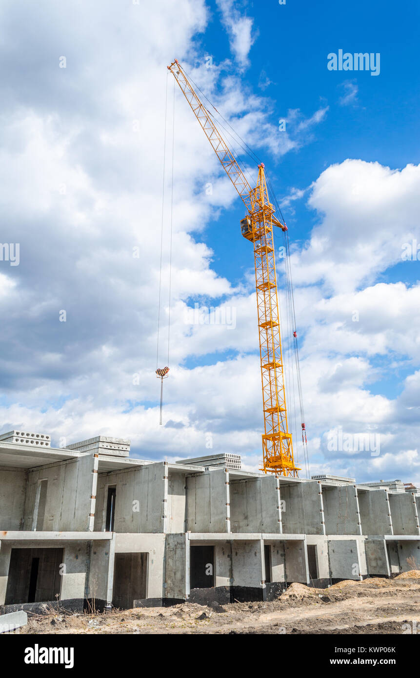 Construction machinery and high-rise building Stock Photo - Alamy