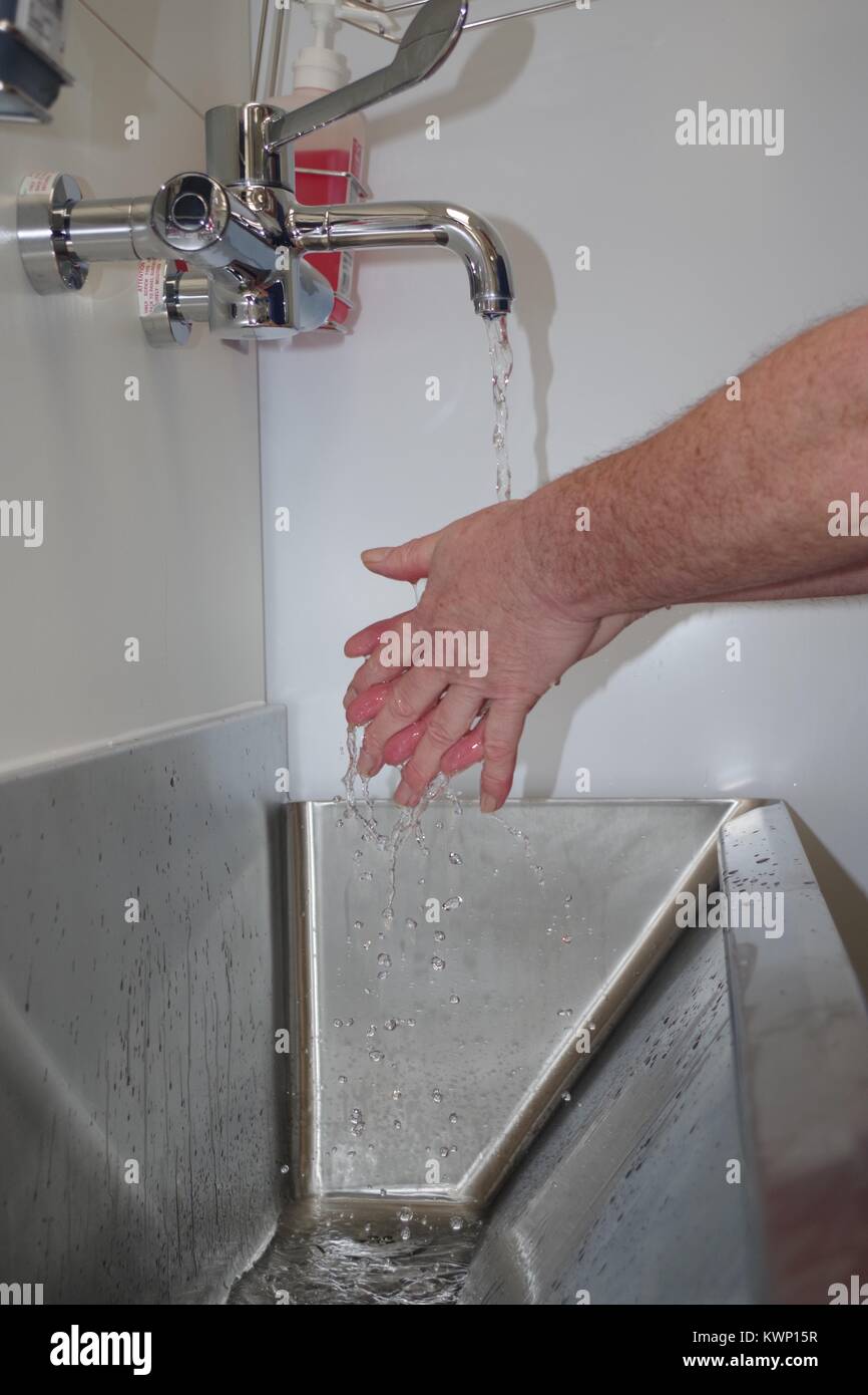 Surgeon Washing Hands in Modern British Hospital Operating Theatre ...