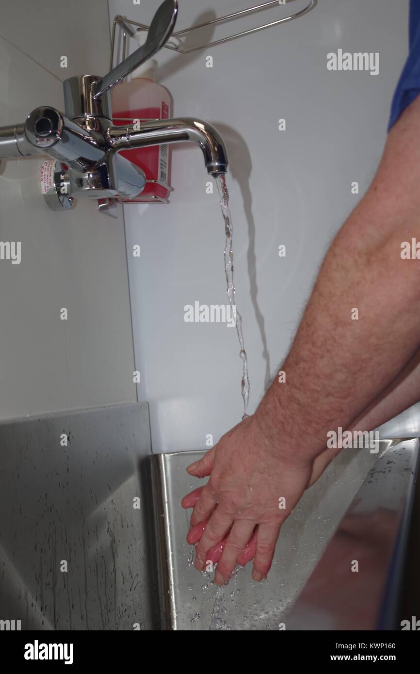 Surgeon Washing Hands in Modern British Hospital Operating Theatre ...