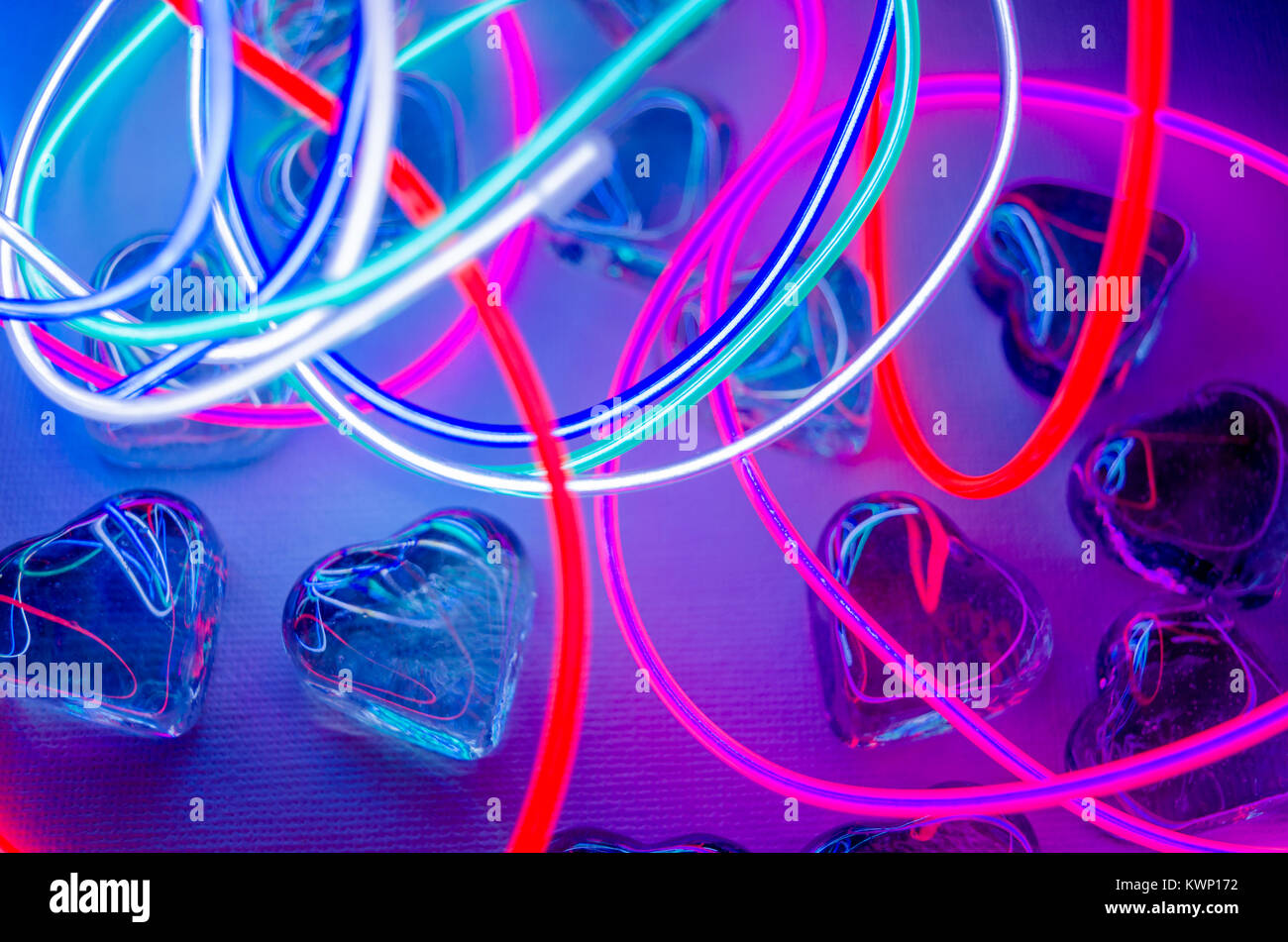 A Studio Photograph of Glass Hearts with Abstract Pink Neon Lighting ...