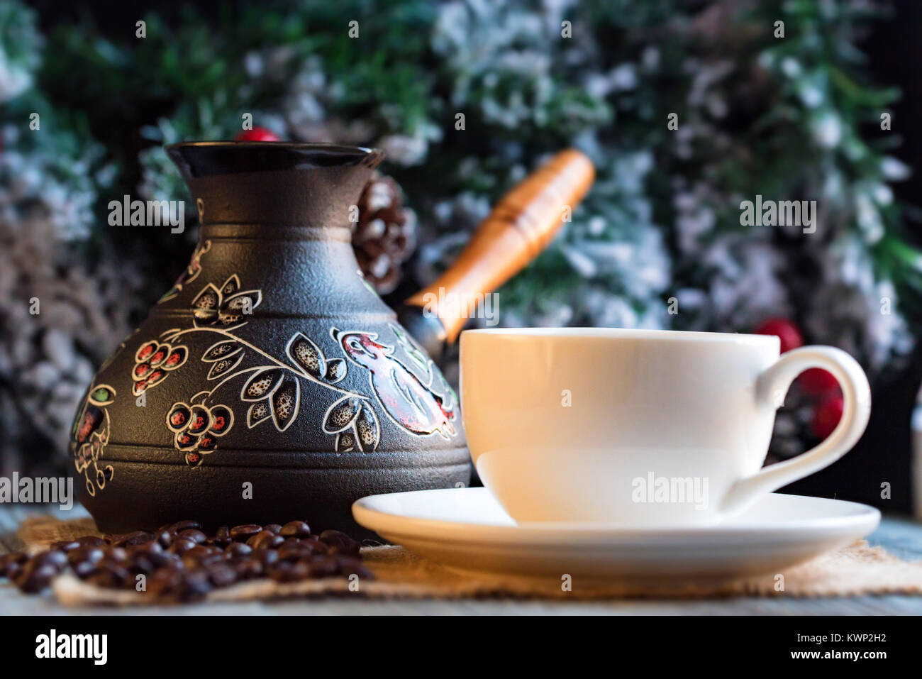 Cozy winter setting with cup of coffee and cezva Stock Photo - Alamy