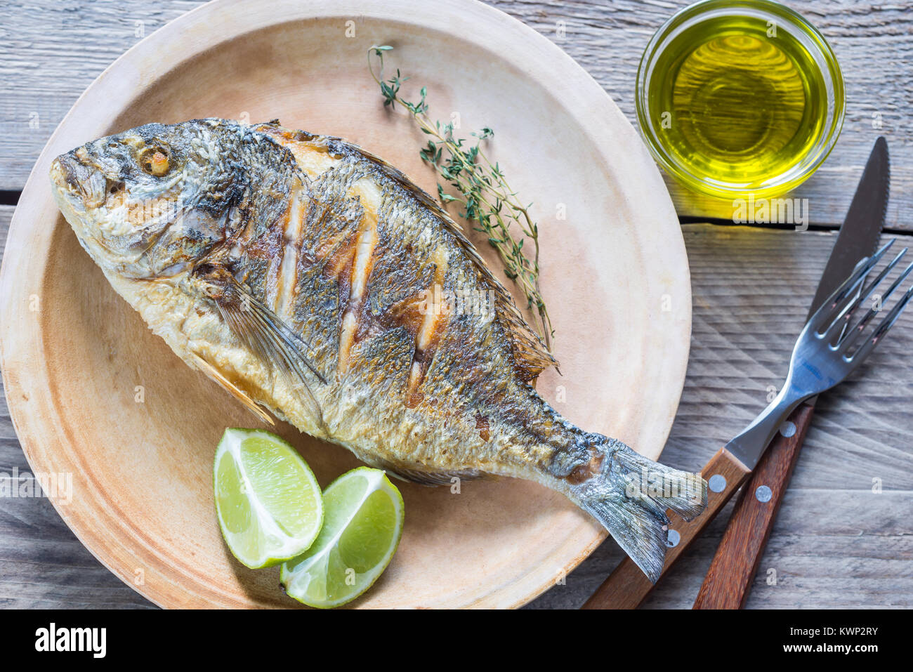 Grilled Dorade Royale Fish on the plate Stock Photo - Alamy