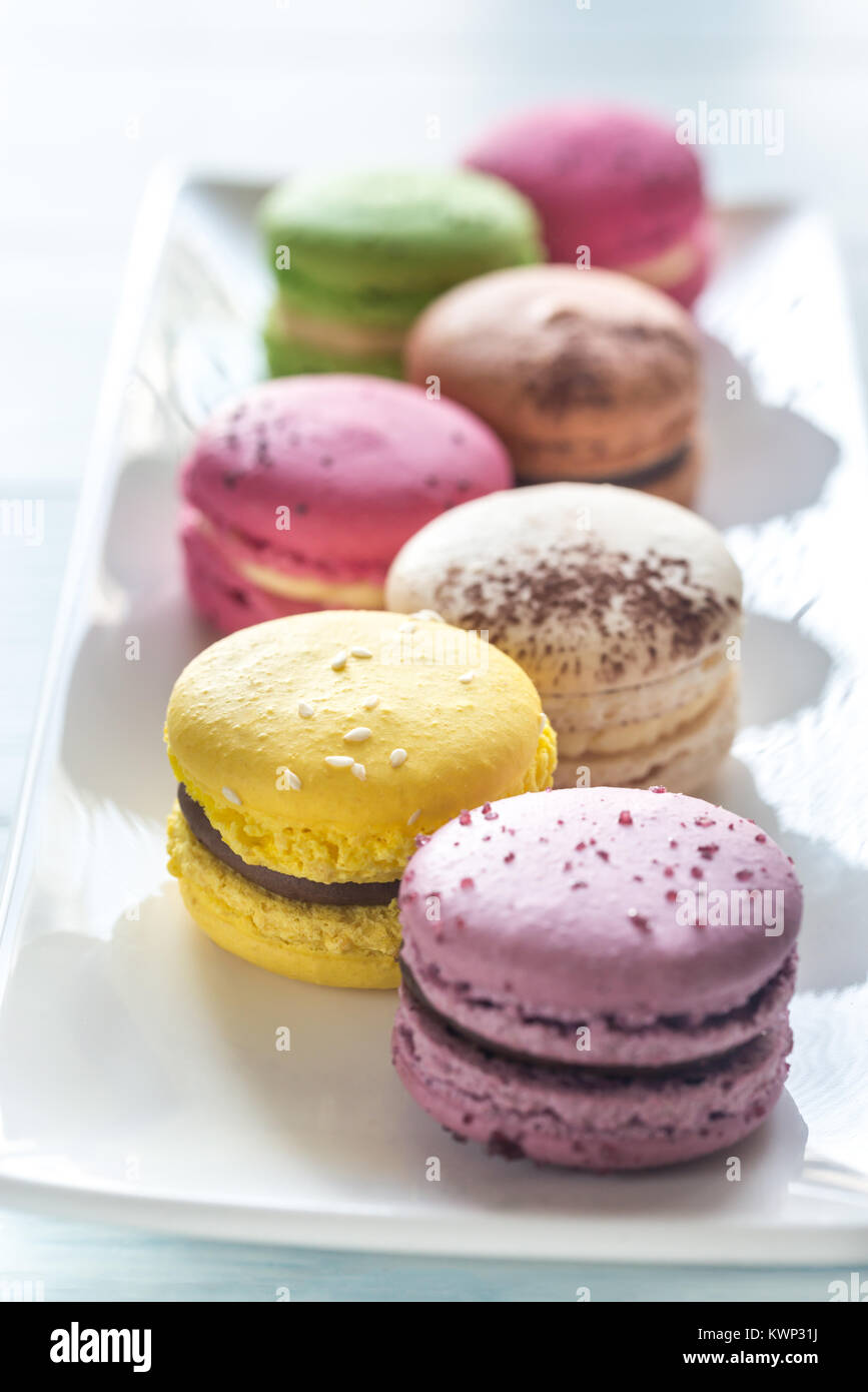 Colorful macarons on the white plate Stock Photo - Alamy