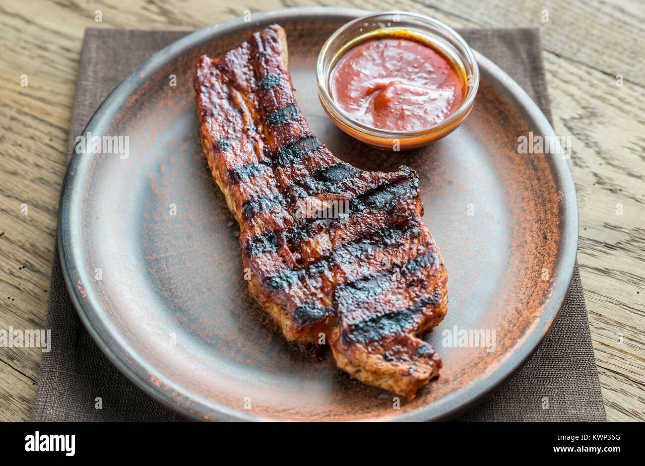 Portion of grilled pork ribs Stock Photo - Alamy
