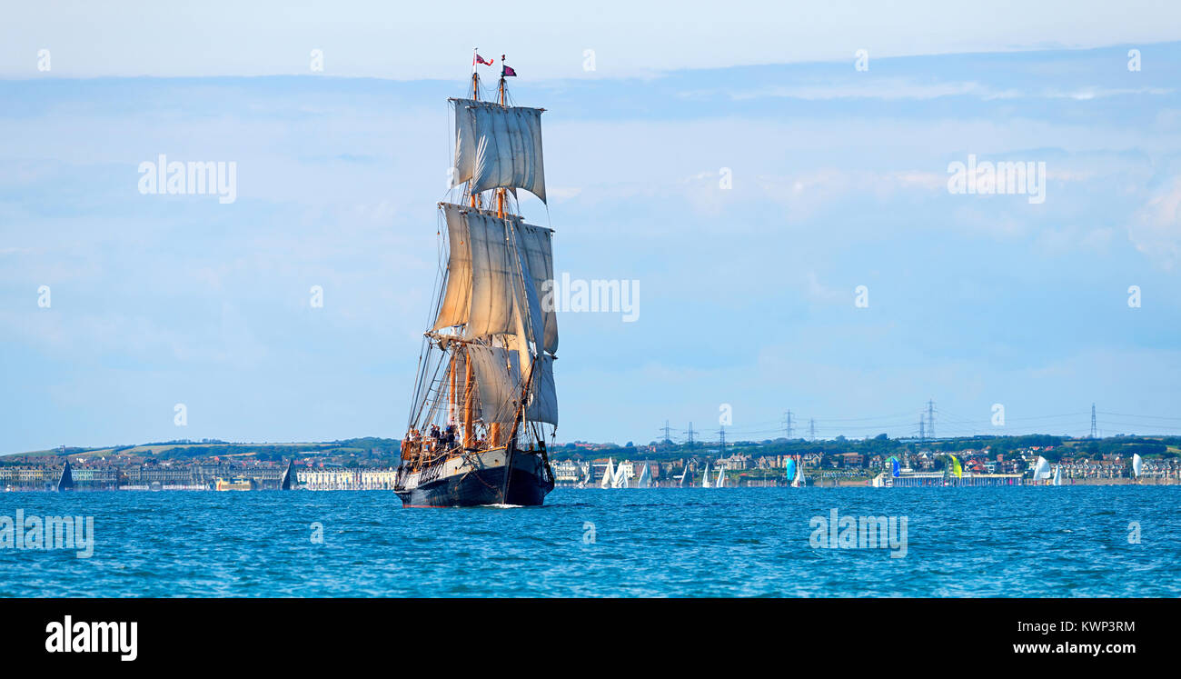 Tall ship the Earl of Pembroke sailing off the Jurassic Coast of Dorset ...