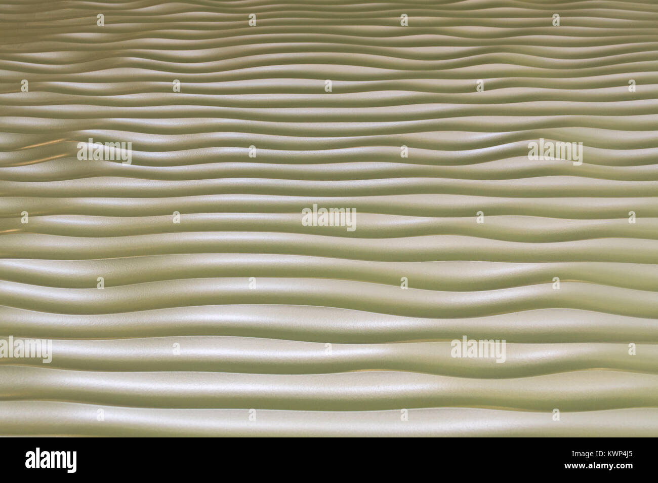 background texture full frame close up of golden undulating metal with ...