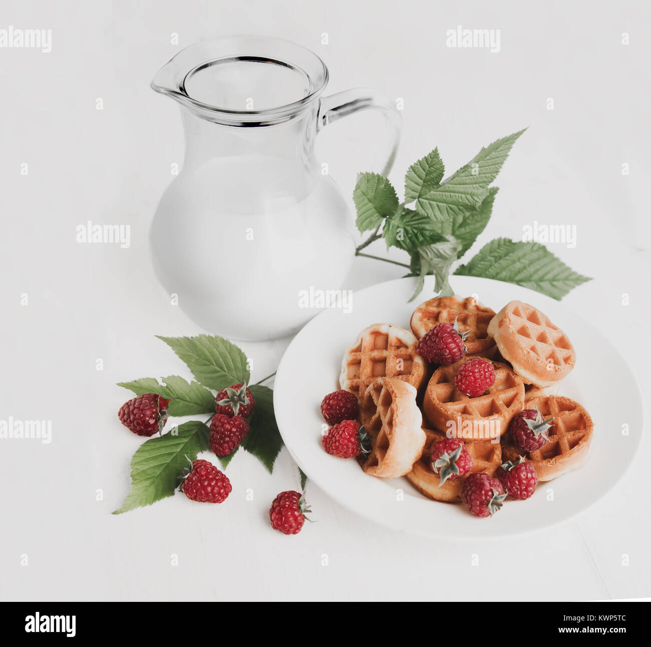 raspberry, milk in a jar and cookies Stock Photo - Alamy