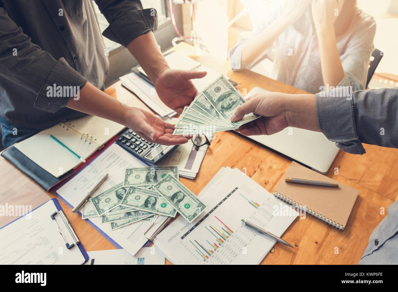 Businessman giving financial document hi-res stock photography and ...