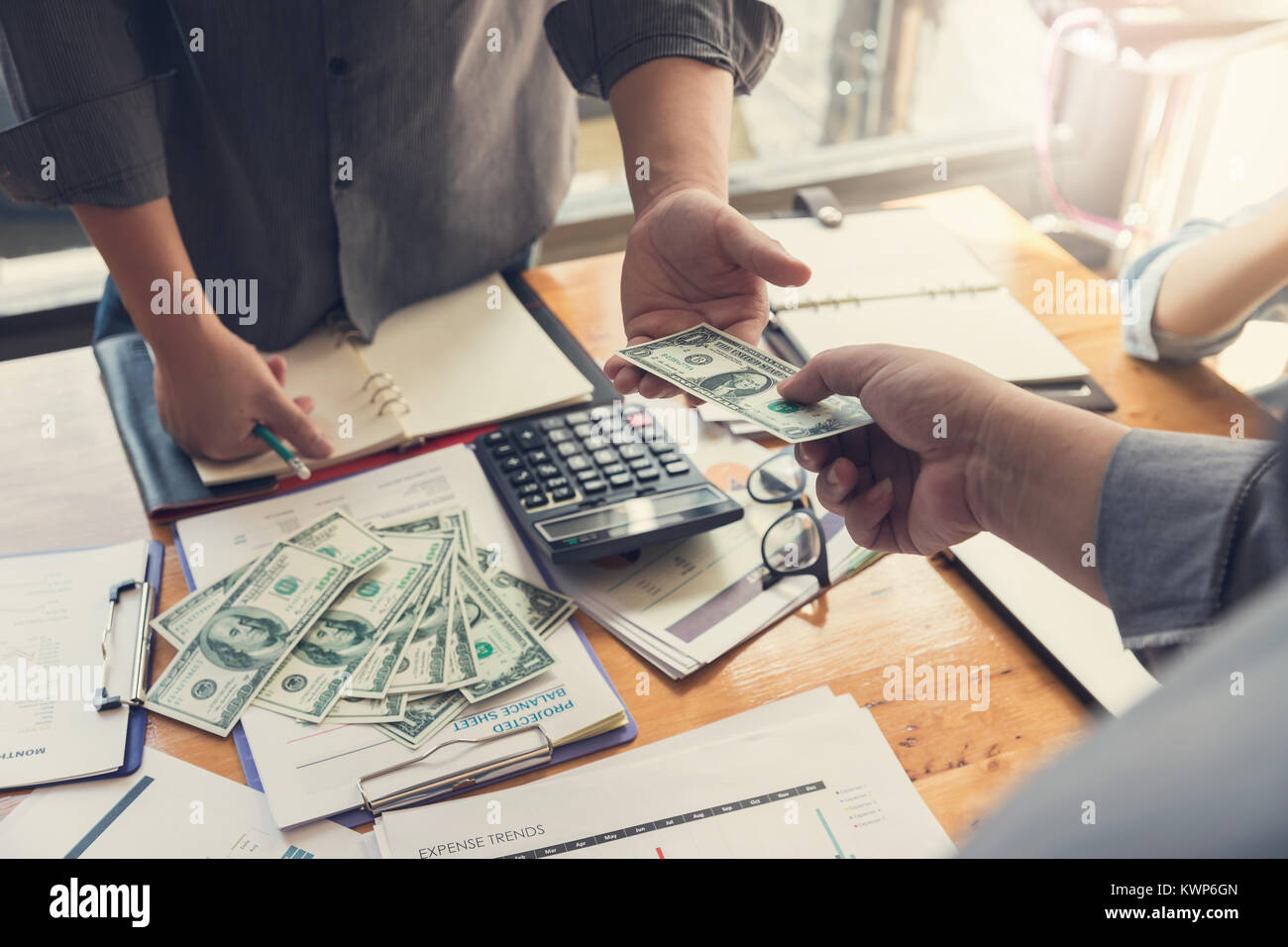 Business and finance concept, Hand of a businessman giving money to his ...