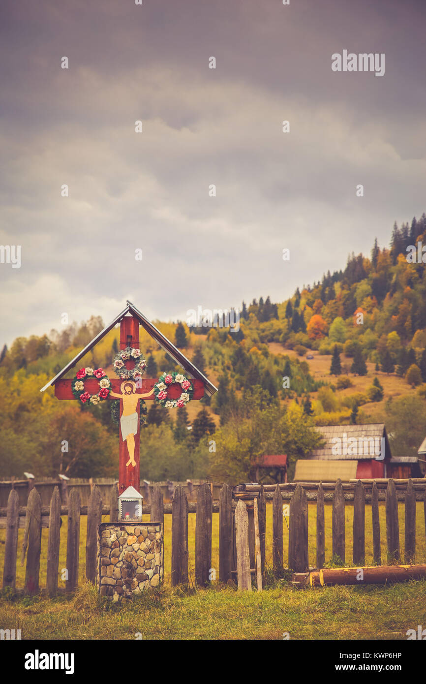 Traditional religious cross symbol with autumn scenery background in ...