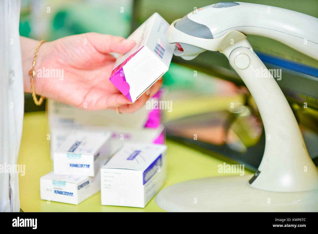 Pharmacist scanning barcode of medicine drug in a pharmacy drugstore ...