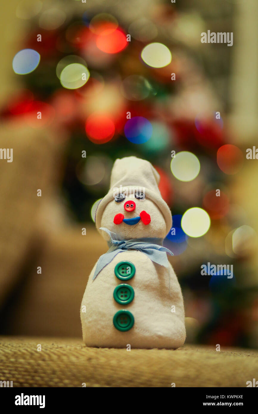 Handmade snowman made from a sock filled with rice and decorated with ...