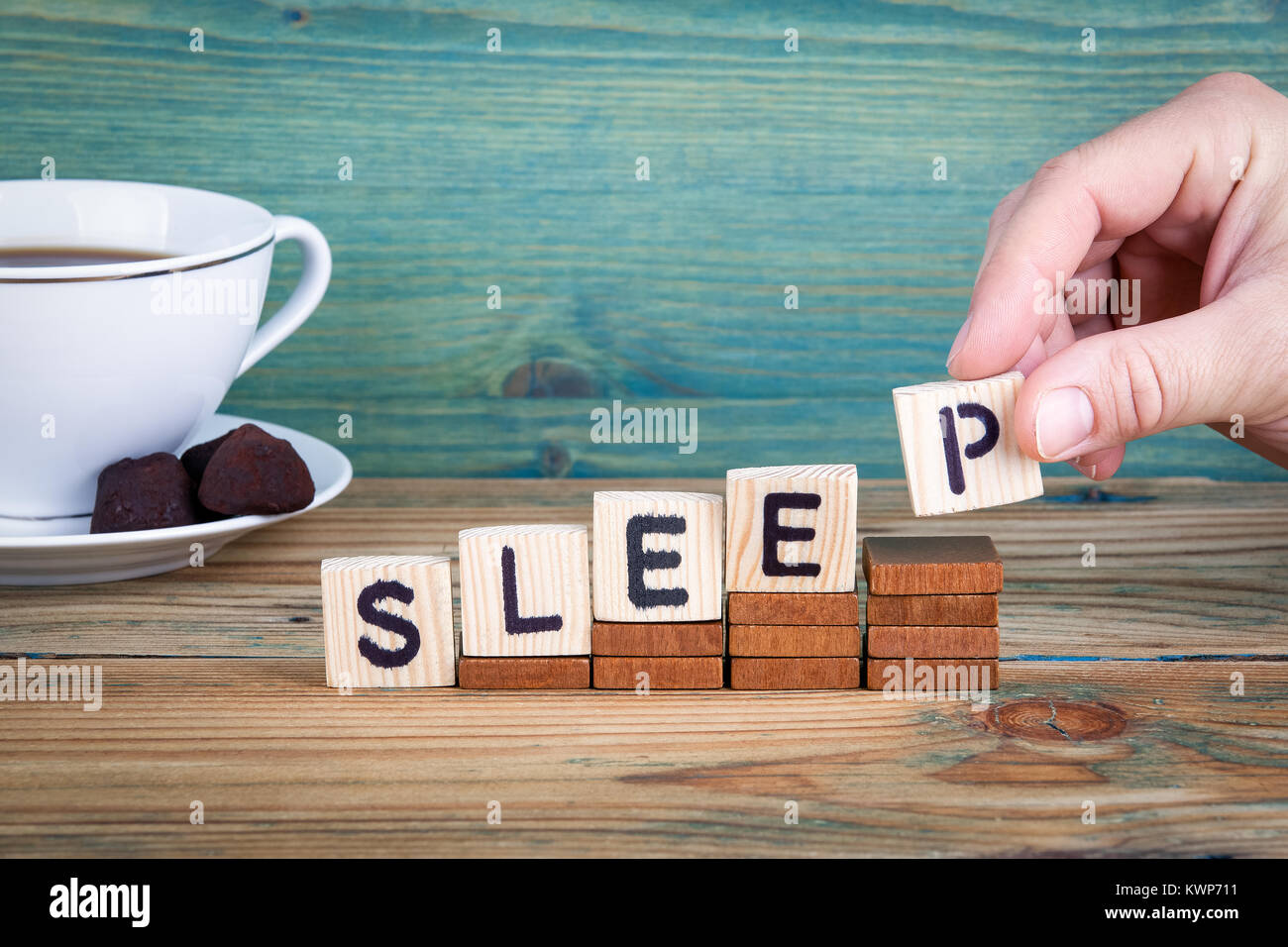 sleep. Wooden letters on the office desk, informative and communication ...