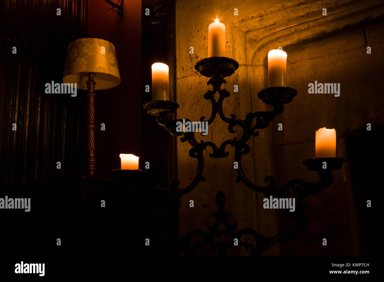 Candles alight by a fireplace Stock Photo - Alamy