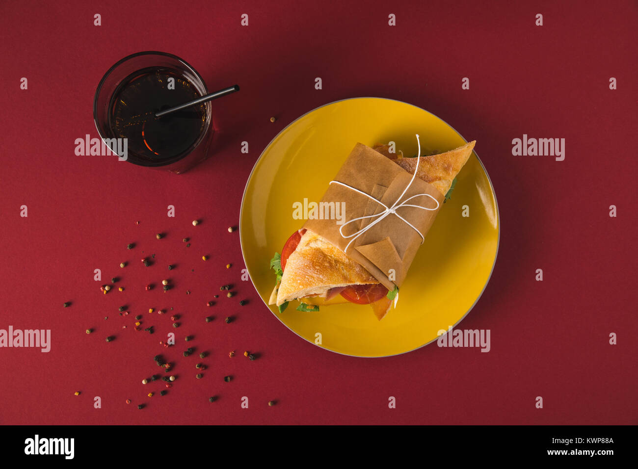 top view of sandwich on plate and glass of cola on table Stock Photo ...