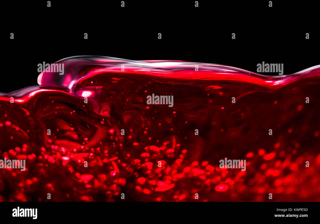 Red wine on black background, abstract splashing. Saved clipping path ...