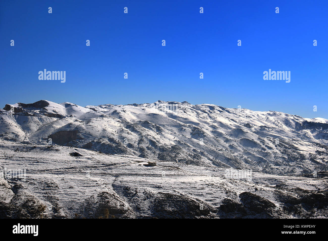 Lebanese mountains covered in snow under a blue sky Stock Photo - Alamy